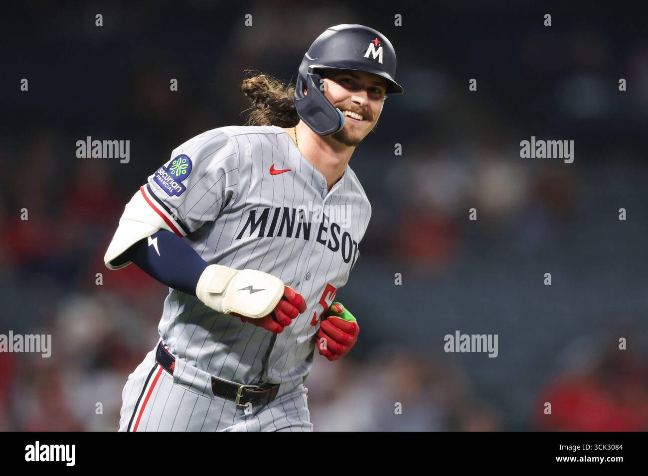 Minnesota Twins' Ryan Fitzgerald reacts while running the bases after ...