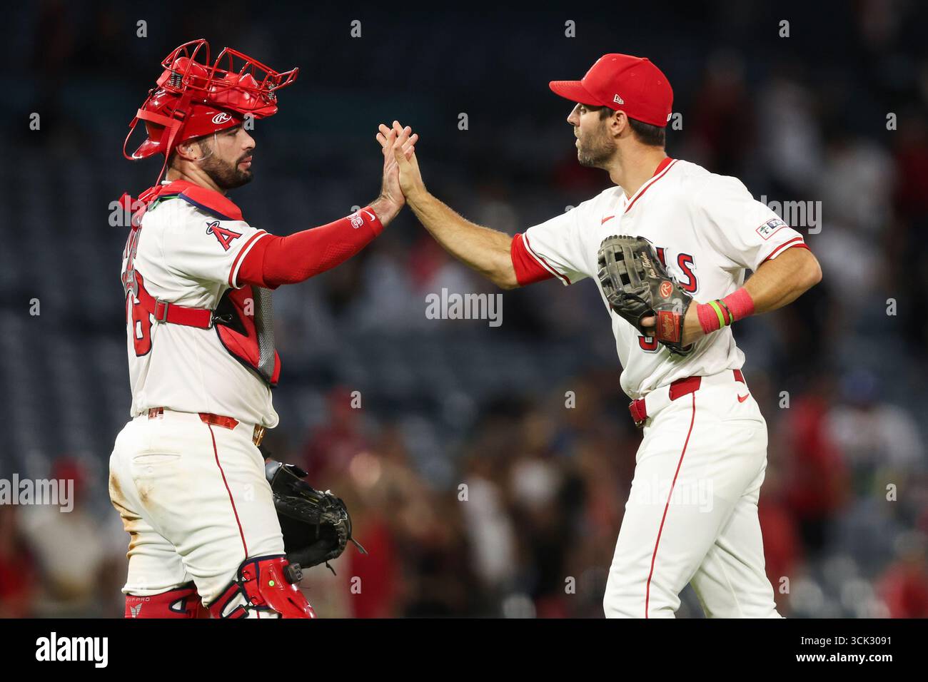 Los Angeles Angels catcher Sebastián Rivero, left, and right fielder ...