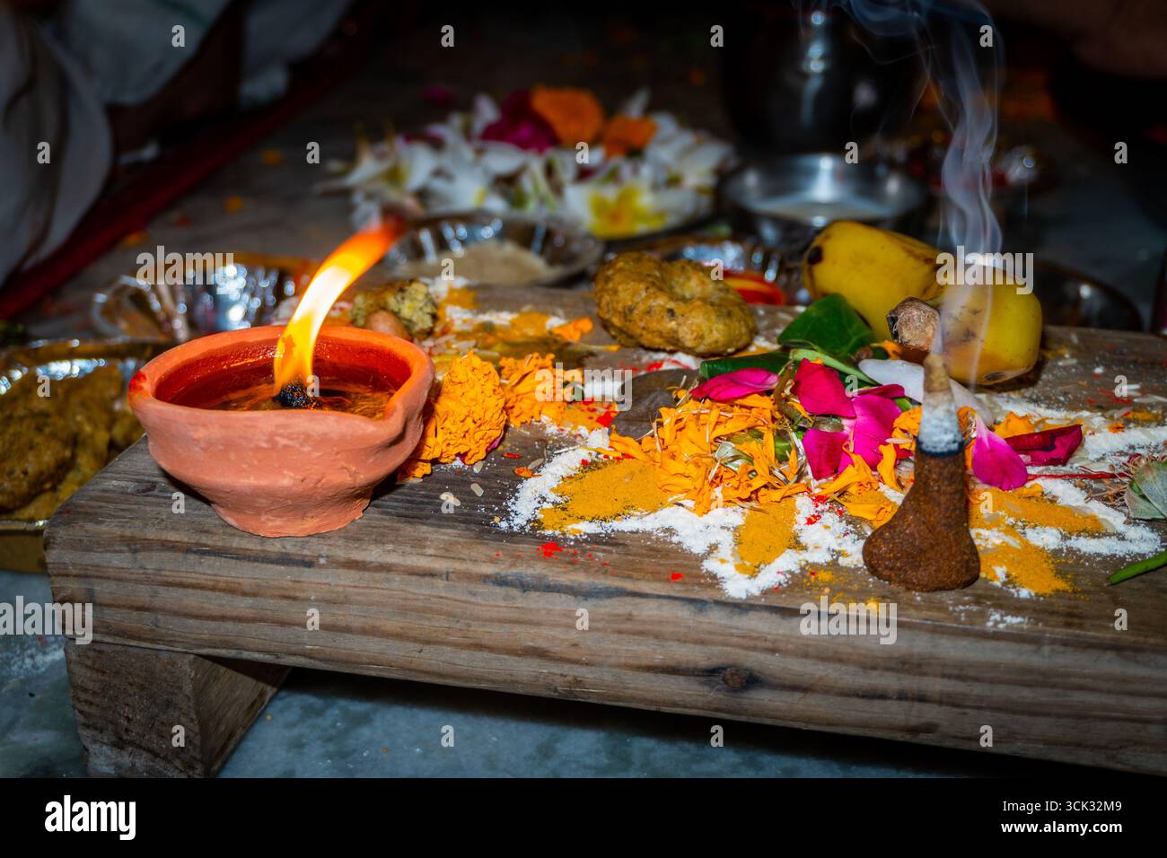 Sacred ritual for ancestors with burning diya, dhoop, fruits, and pooja ...