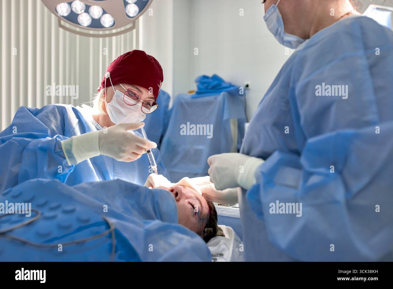 A skilled team of healthcare professionals performs a surgical ...