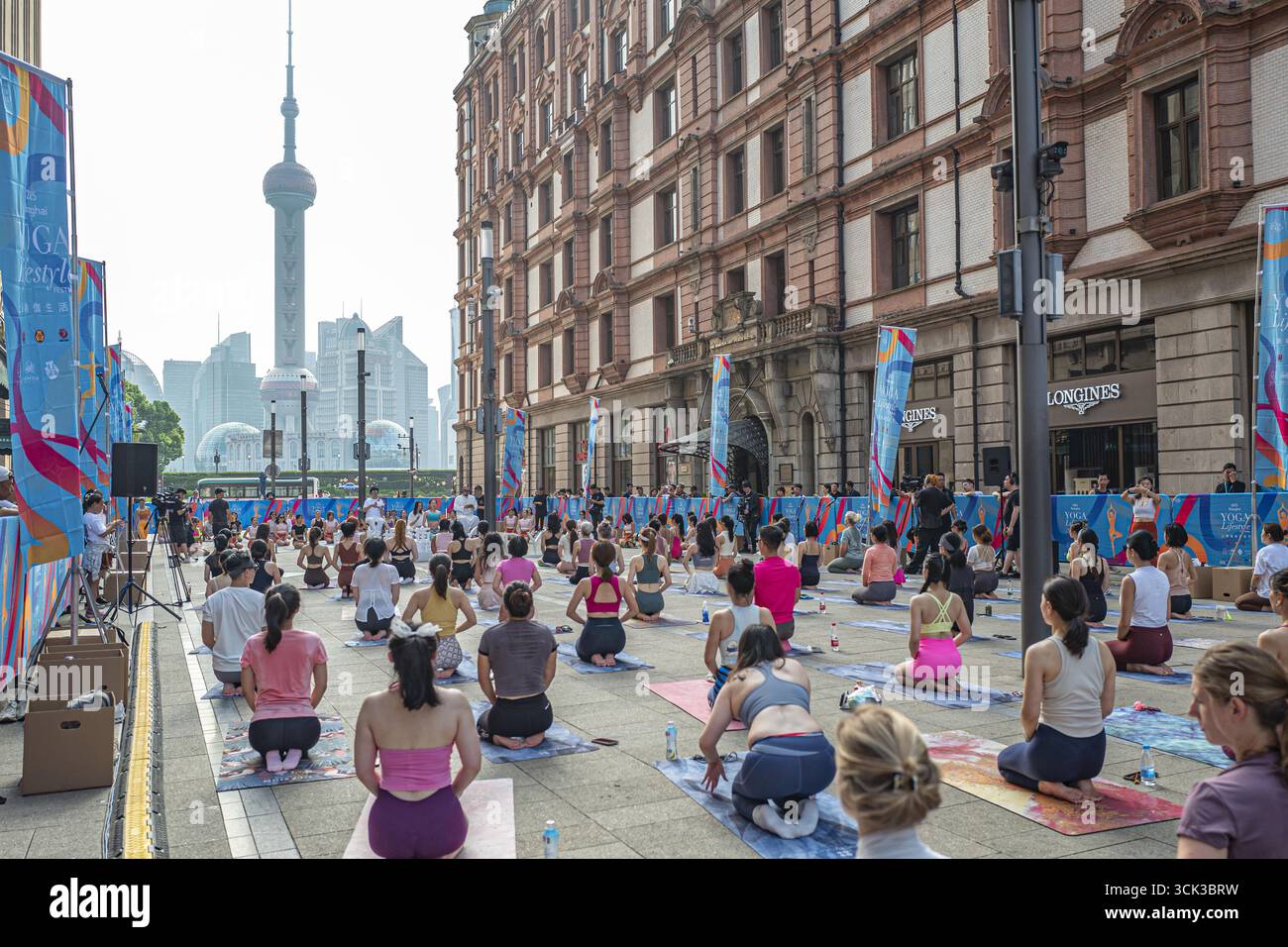 People take part in a yoga activity in Shanghai, China, 7 September ...
