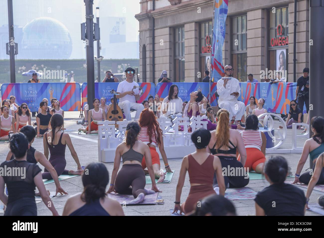 People take part in a yoga activity in Shanghai, China, 7 September ...