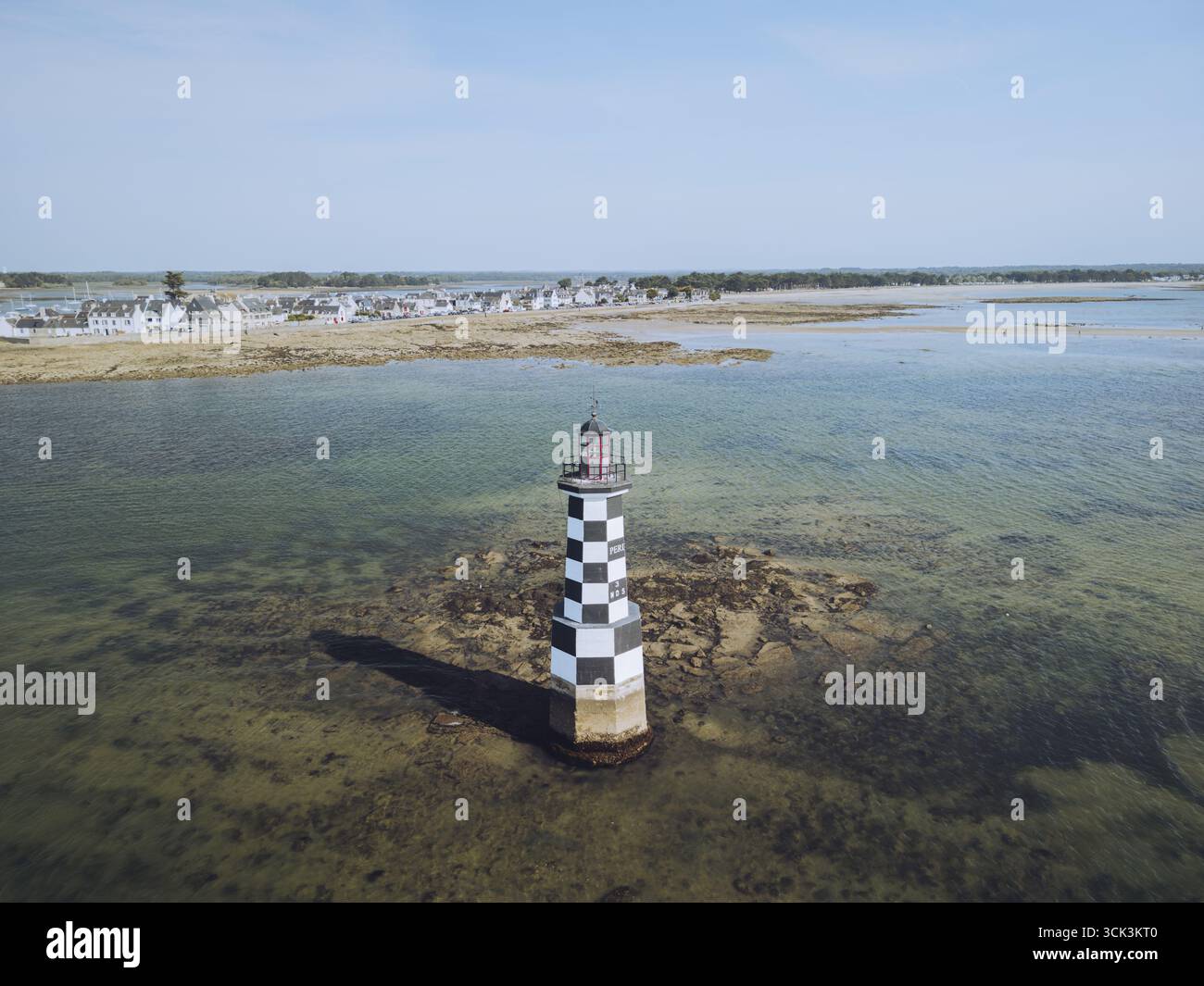 Aerial view of the black and white striped Phare de la Perdrix standing ...