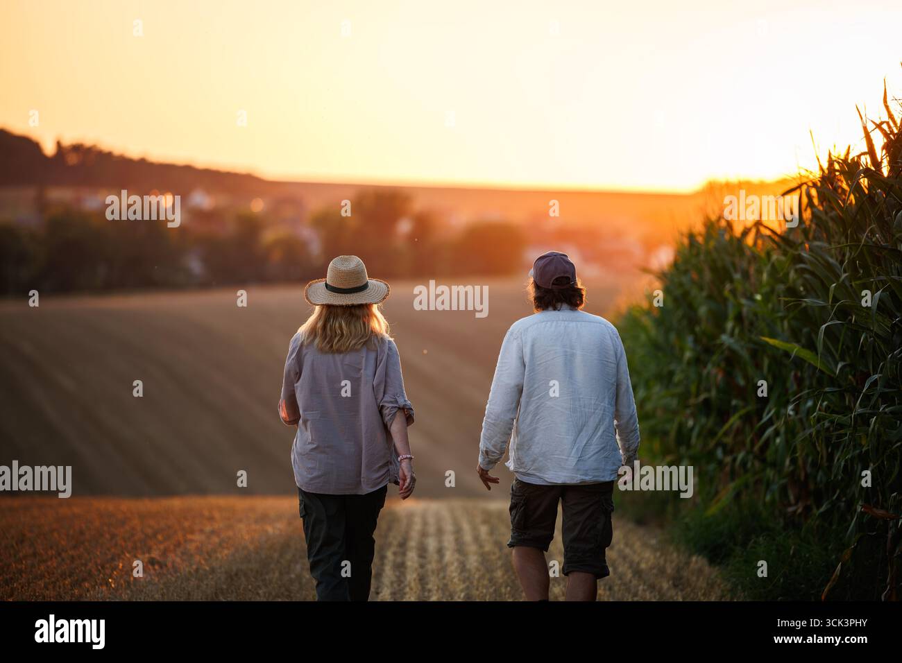Two farmers walking across field hi-res stock photography and images ...