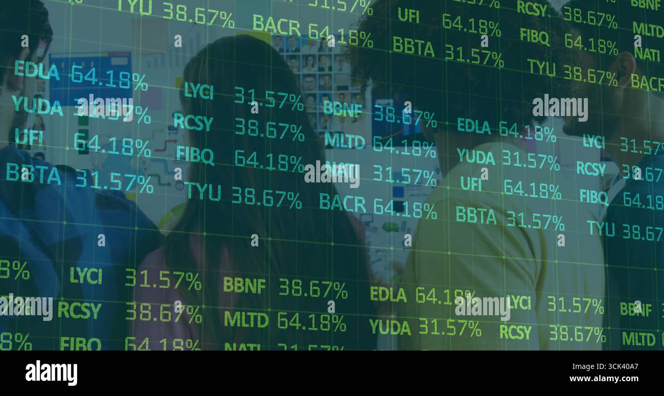 Finance professionals examining charts and stock tickers in office ...