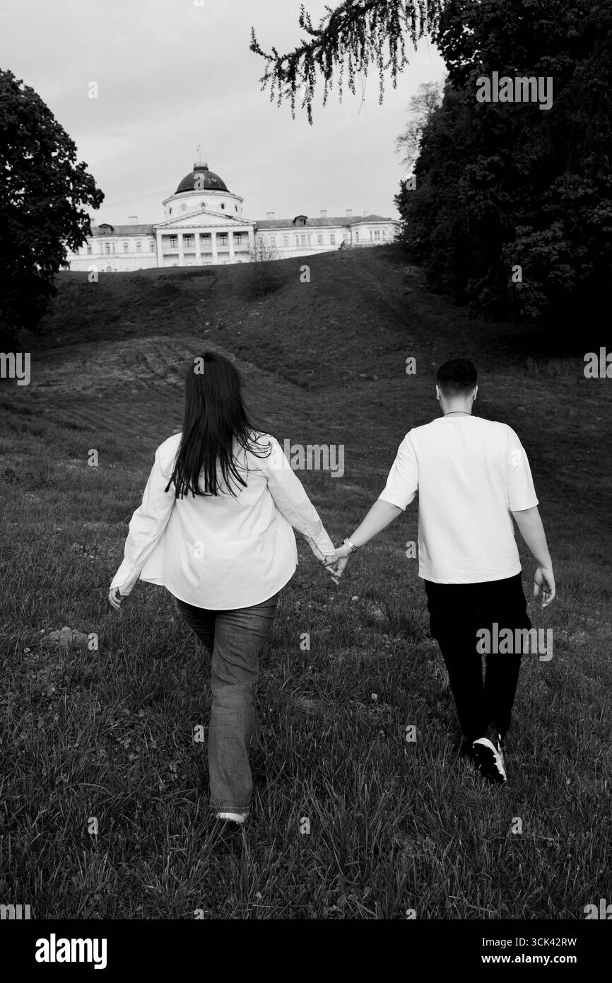 Two hands in green Black and White Stock Photos & Images - Alamy