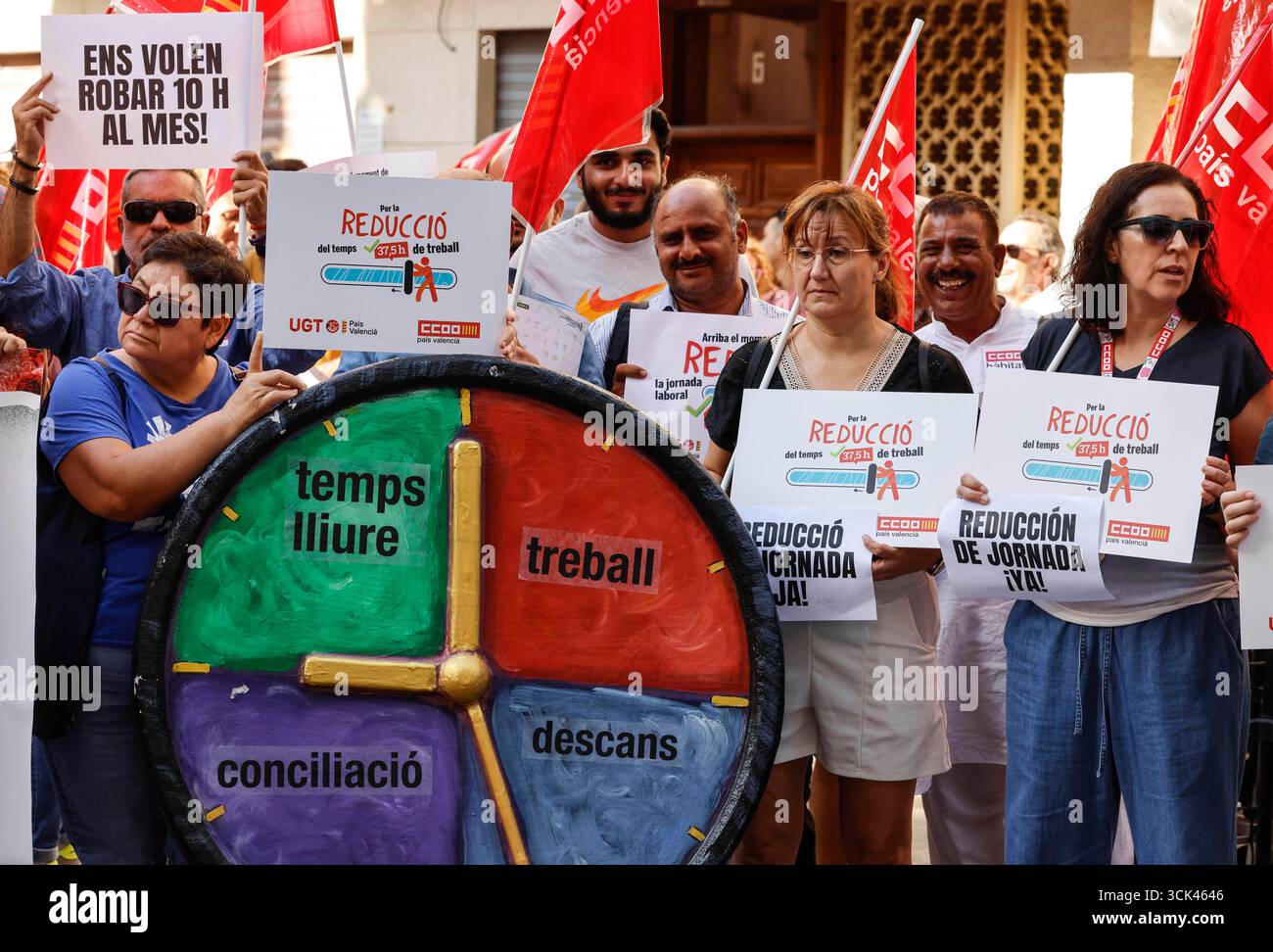 Several people protest with banners and flags, during a rally to demand ...