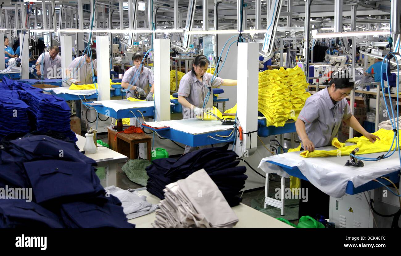 Workers are producing labor protective clothing in the production ...