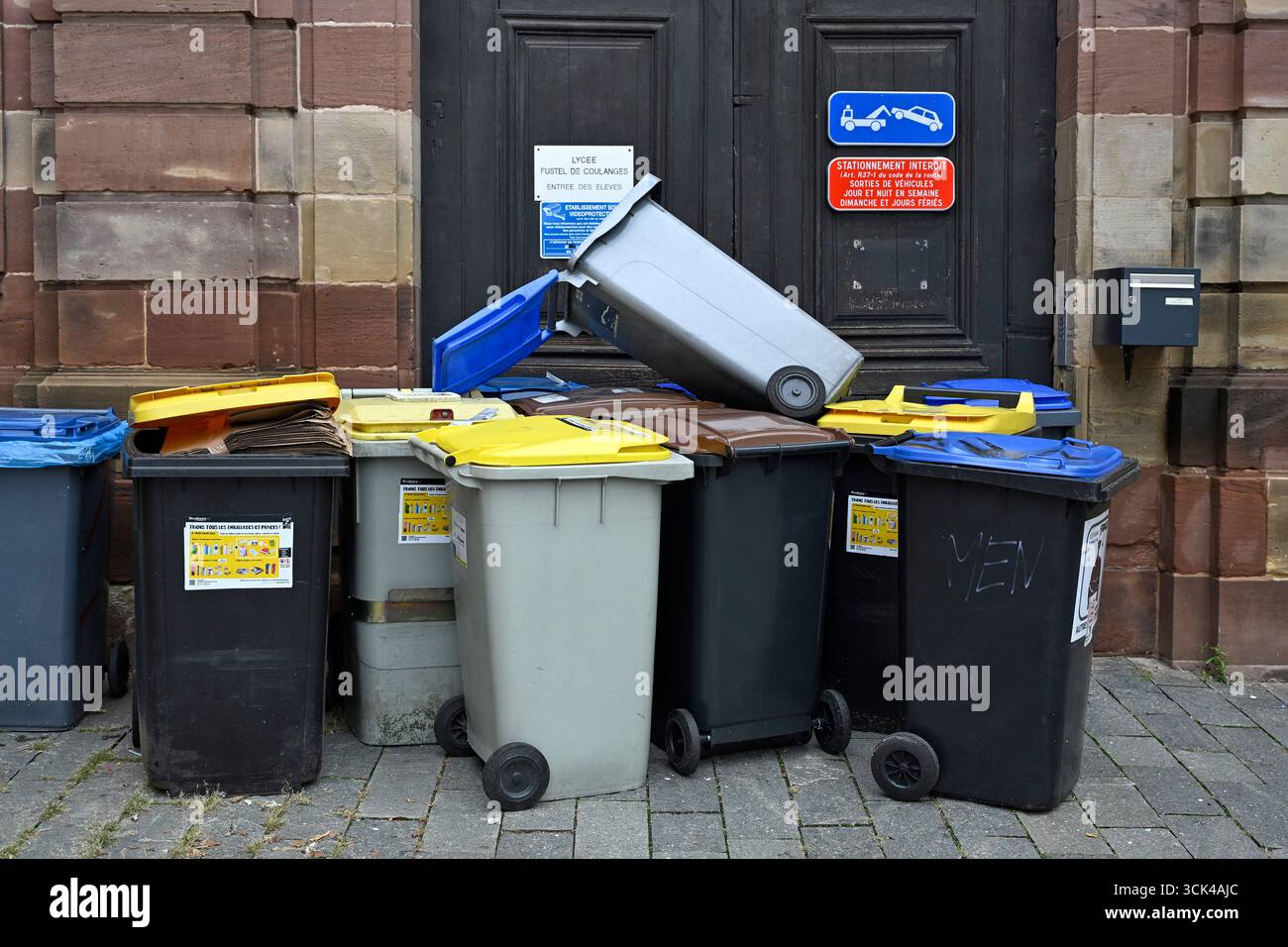 The entrance of a school is blocked by garbage bins in Strasbourg ...