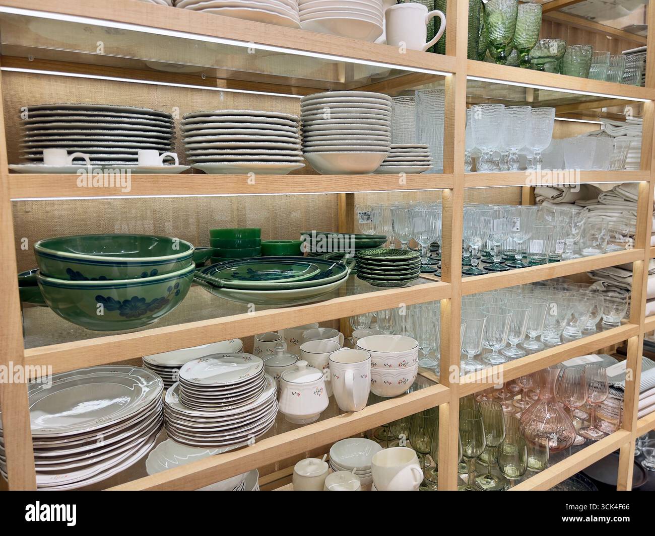Assorted dishware featuring plates, bowls, and glasses displayed on ...