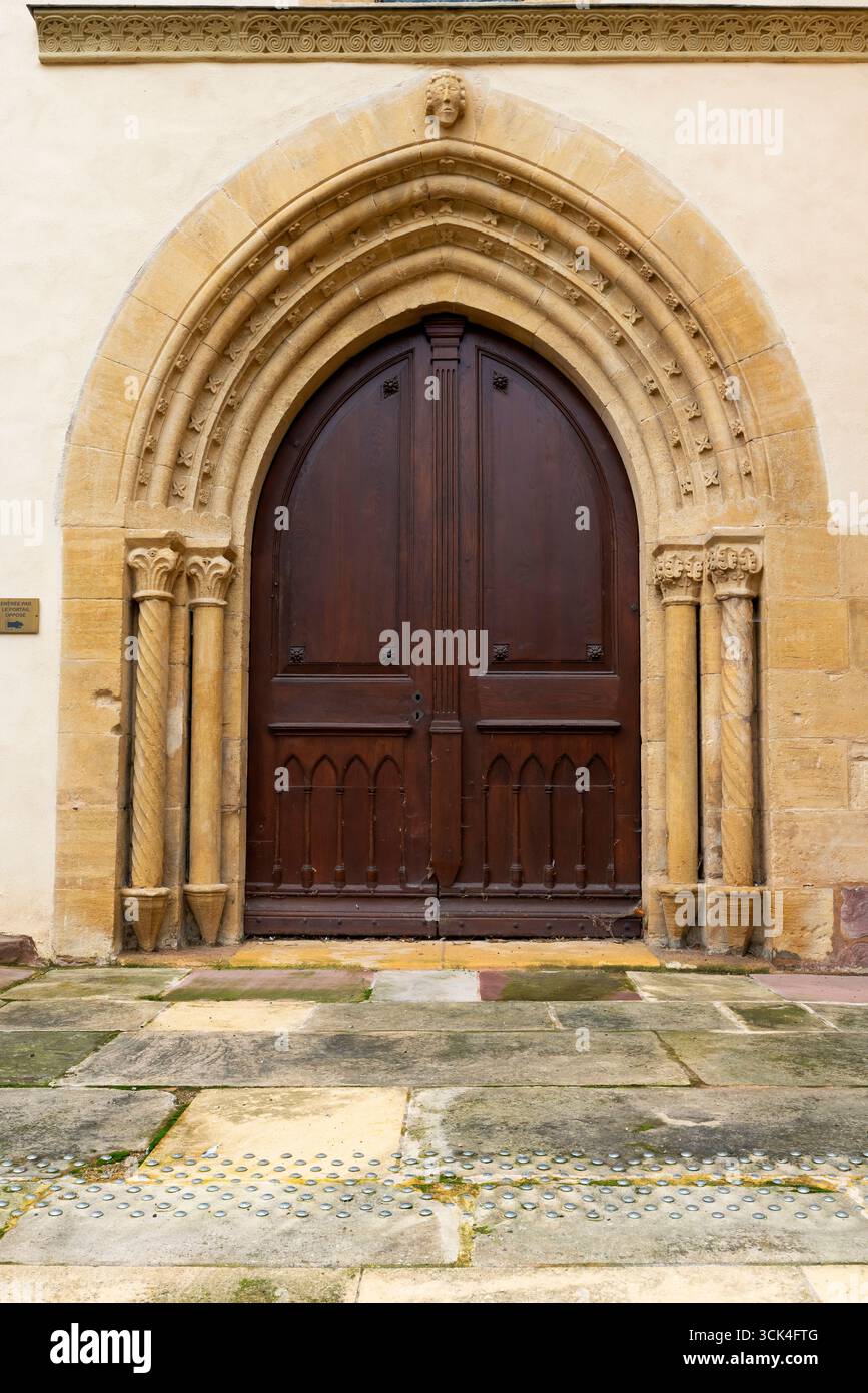 The Romanesque north portal, surmounted by a head of Christ. Église ...