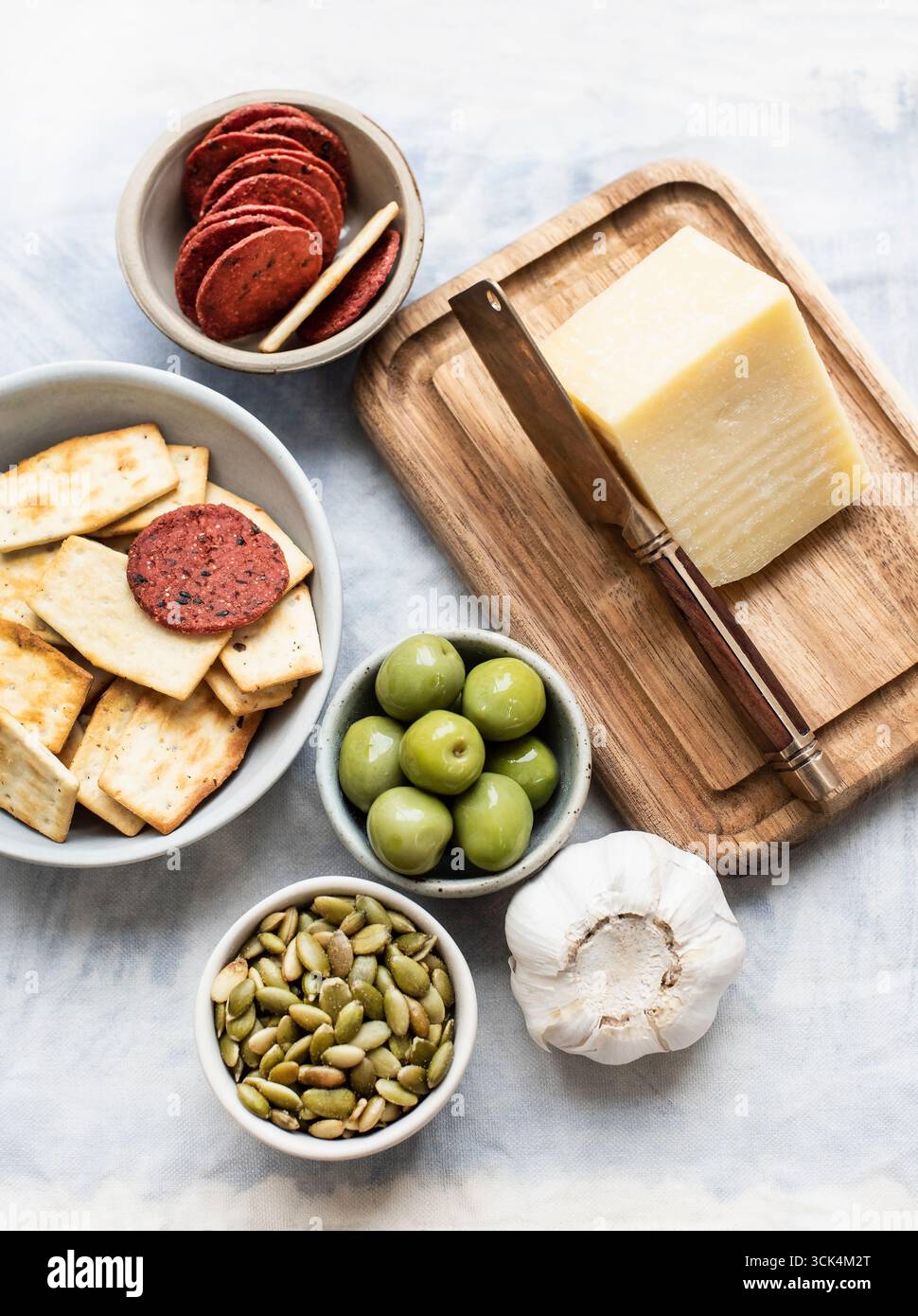Composition of a buffet aperitif with crackers,olives and cheese Stock ...
