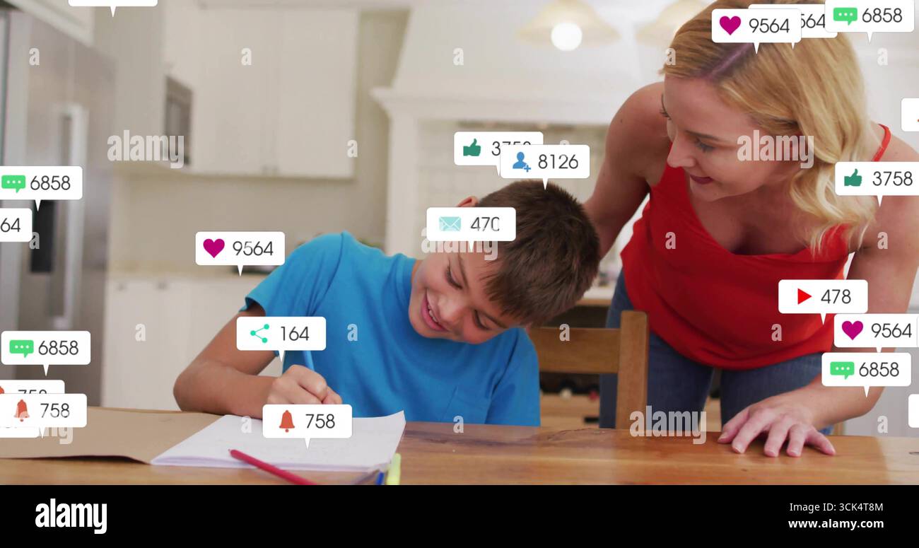 Boy writing mother guiding social hi-res stock photography and images ...