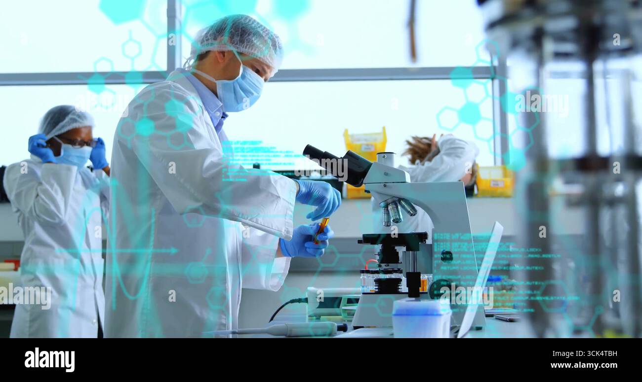 Pipetting scientist wearing lab coat mask gloves at lab bench, with ...