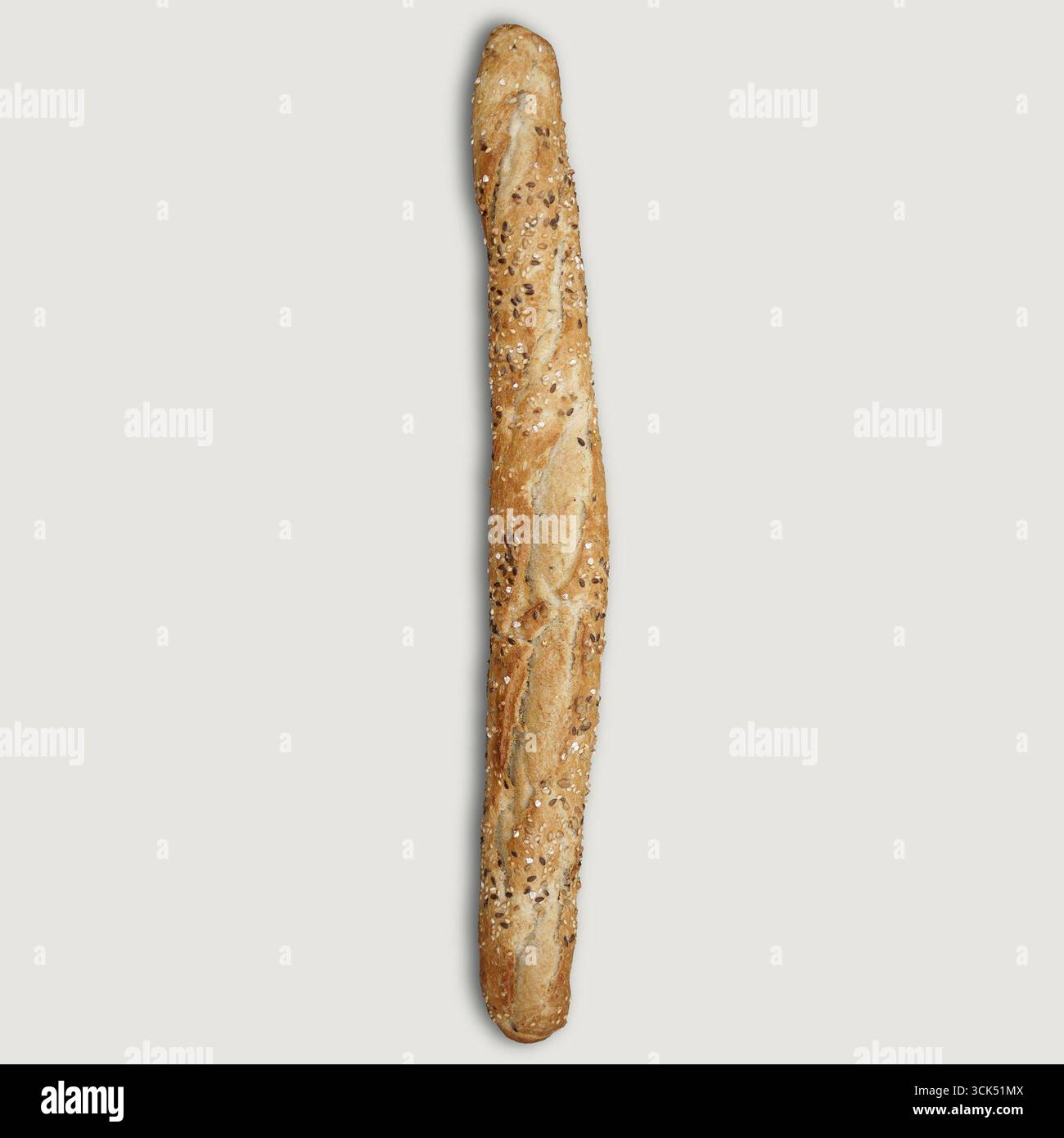 A long, crusty bread stick with a golden-brown crust and sesame seeds ...