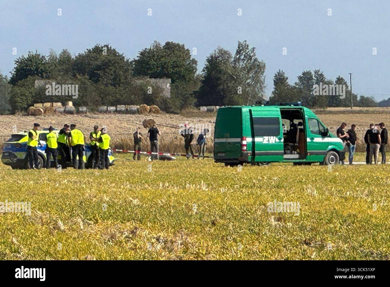 Police and Military Police secure parts of a damaged UAV shot down by ...