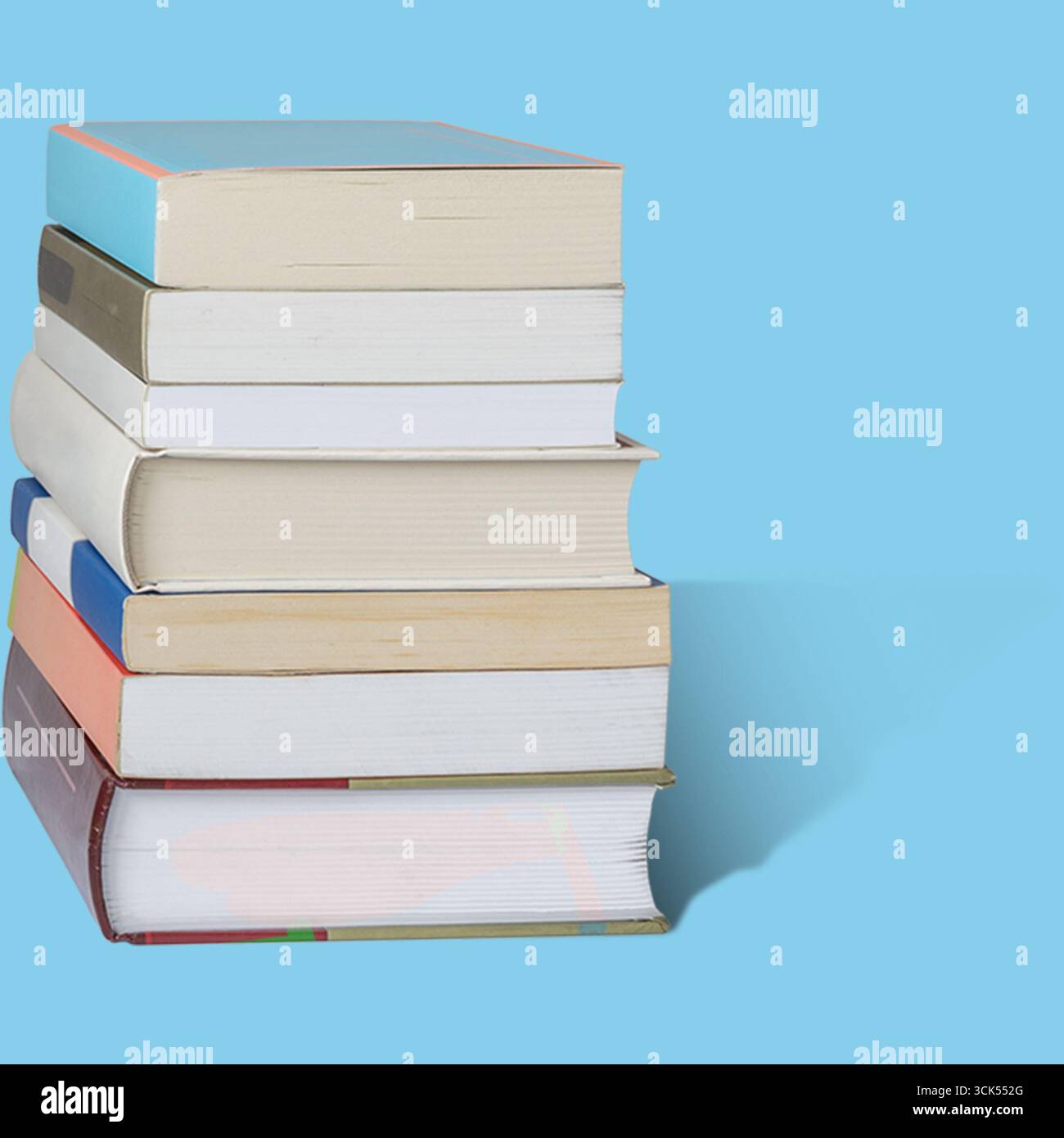 A stack of various books, showcasing different colors and sizes ...
