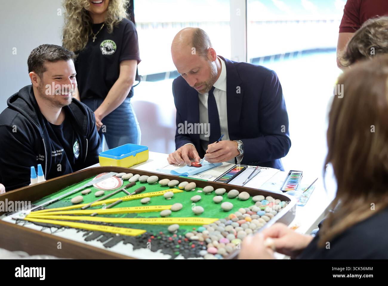 The Prince of Wales participates in arts activities during a visit to ...