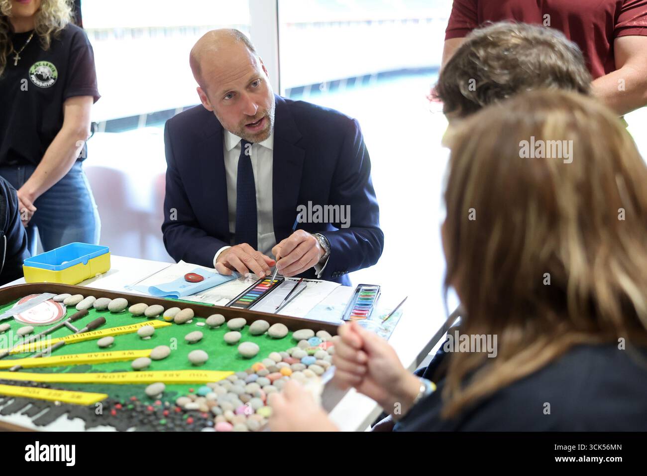 The Prince of Wales participates in arts activities during a visit to ...