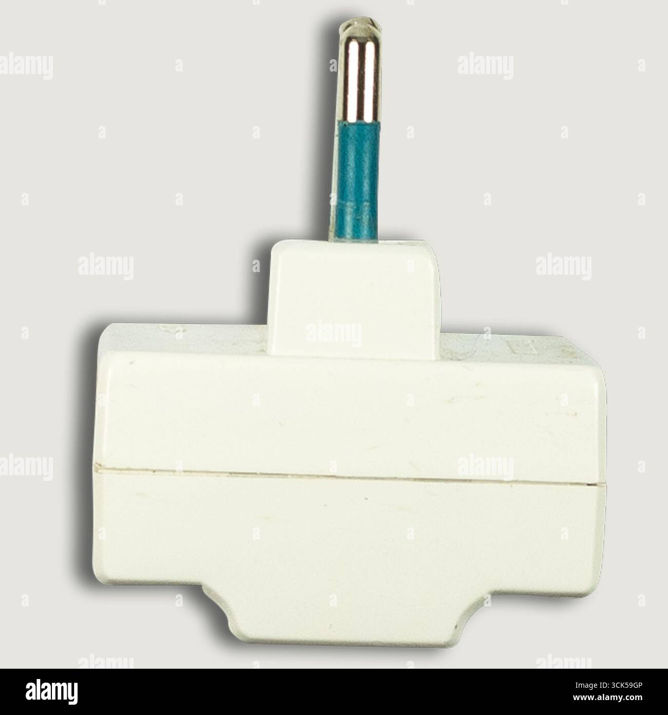 A white electrical plug adapter with a blue pin, designed for ...