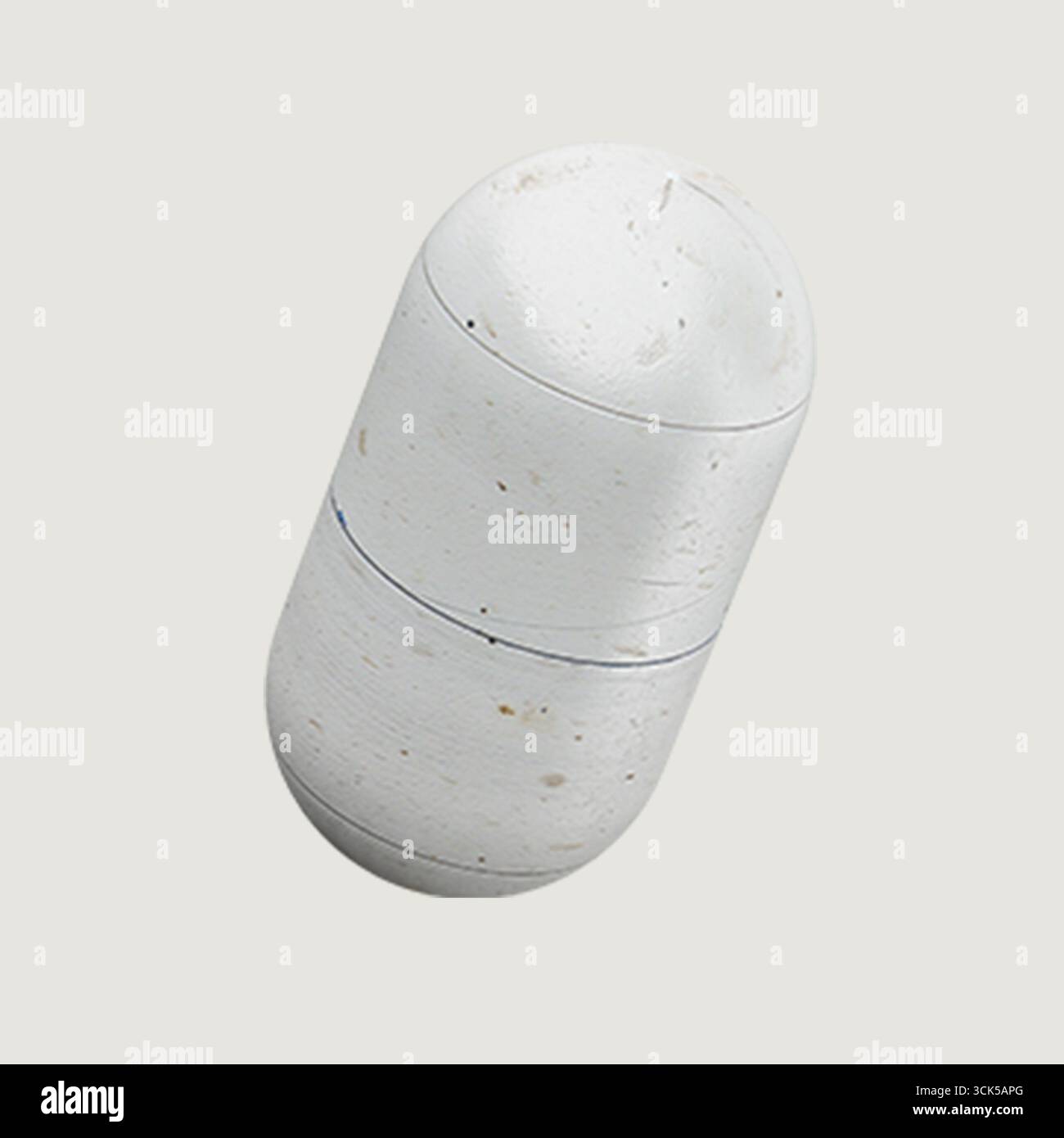 A white capsule, likely representing a medication or supplement ...
