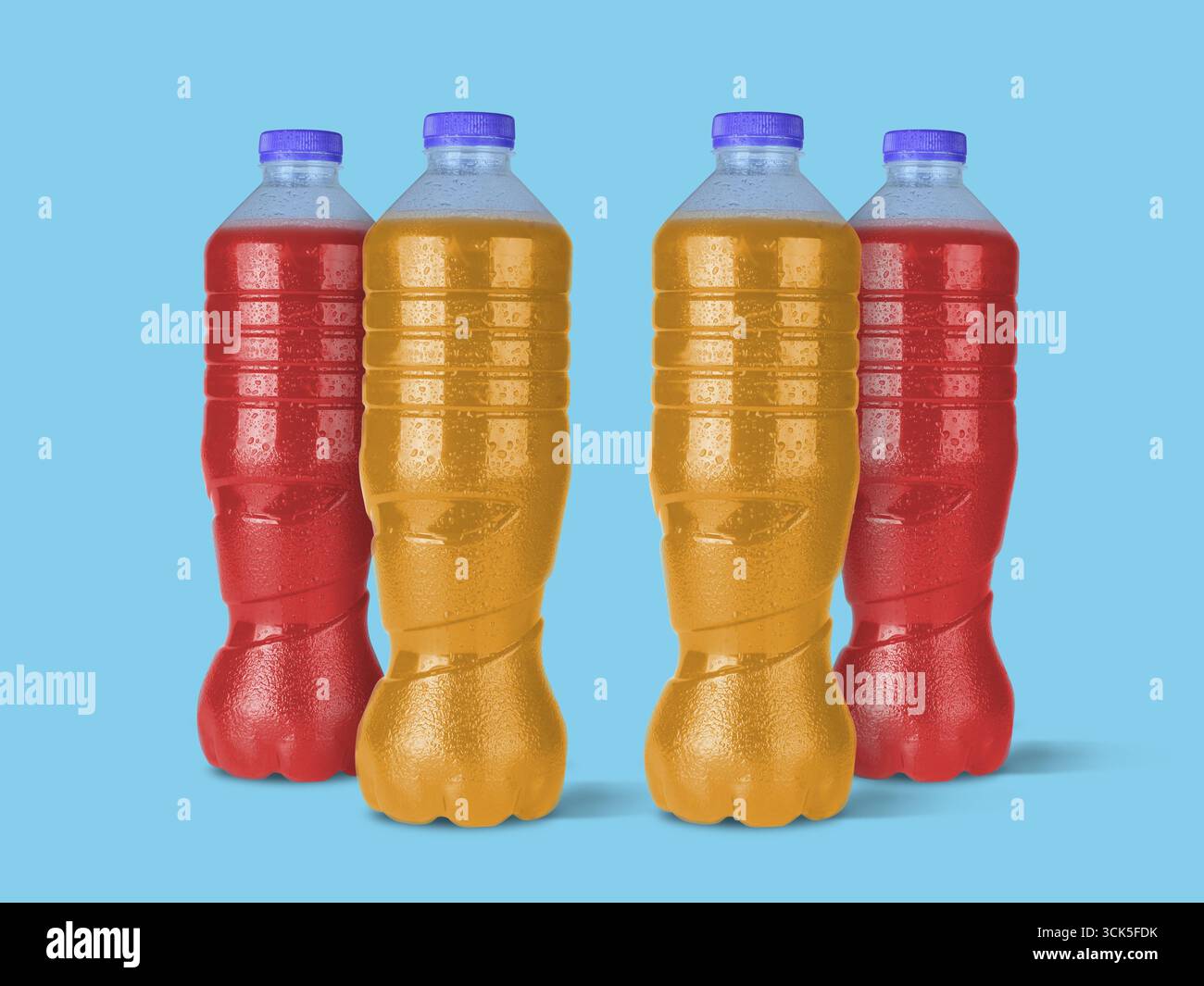 Four colorful plastic bottles filled with beverages, showcasing vibrant ...