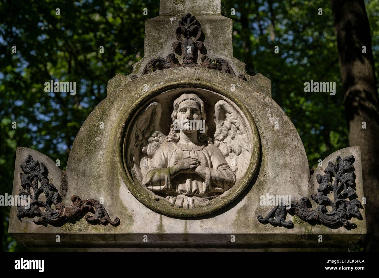 Relief of an angel in old tombstone niche in historic Christian ...