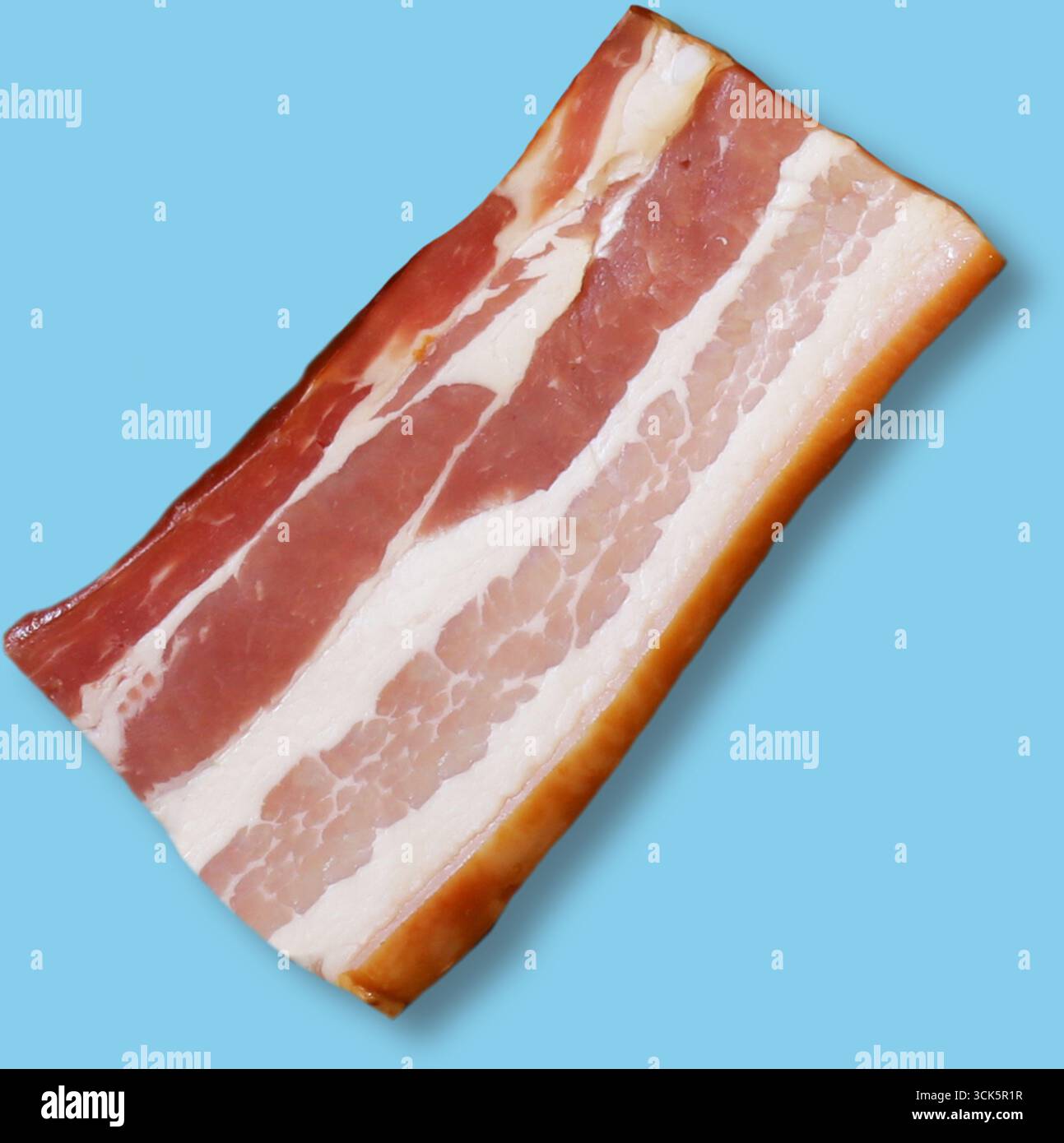 A slice of bacon showcasing its marbled texture and color Stock Photo ...
