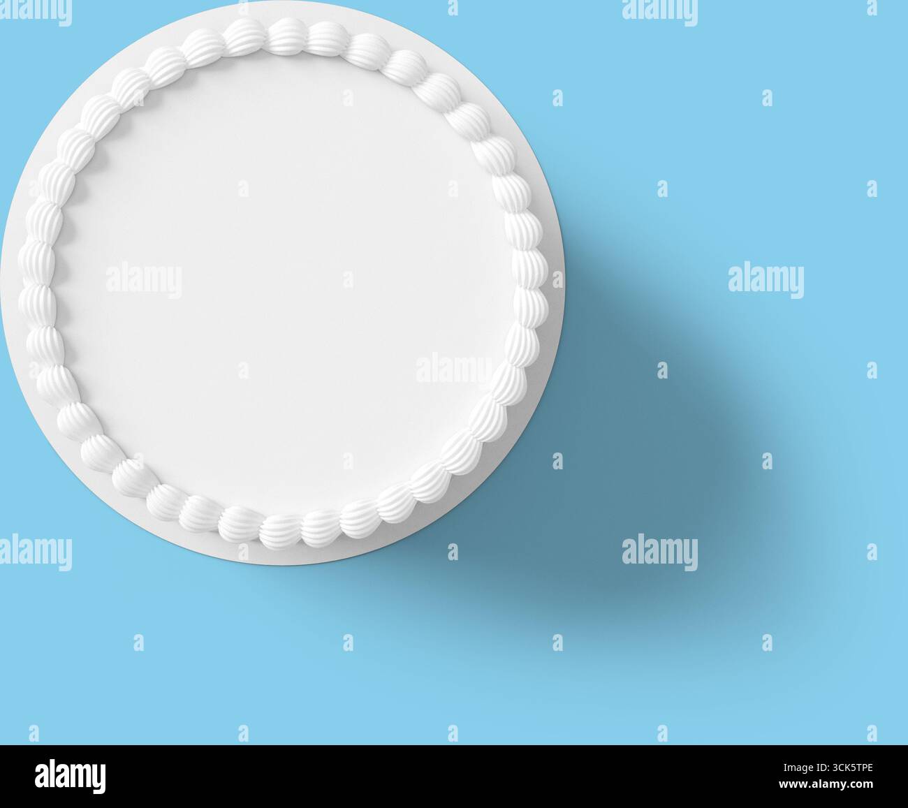 A plain white cake with decorative frosting around the edge, ready for ...