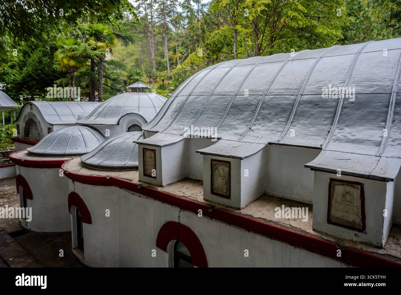 Traditional domed roofs of historic thermal bath buildings surrounded ...