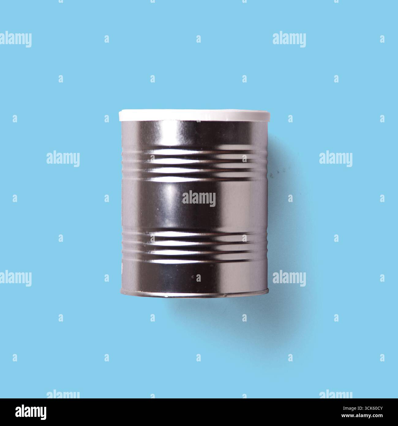 A simple metallic canister with a smooth surface and horizontal ridges ...