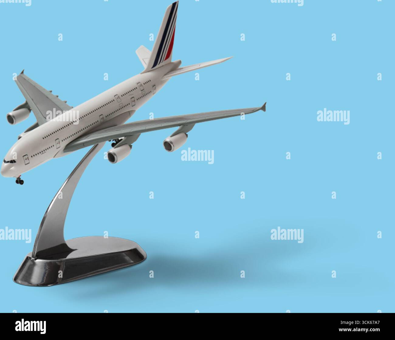 A model airplane displayed on a sleek stand, showcasing its design and ...