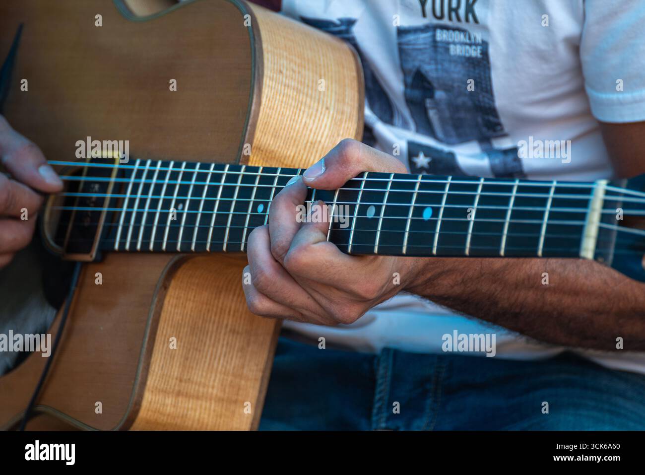 A live performance with a focus on the guitarist's hands A Passionate ...