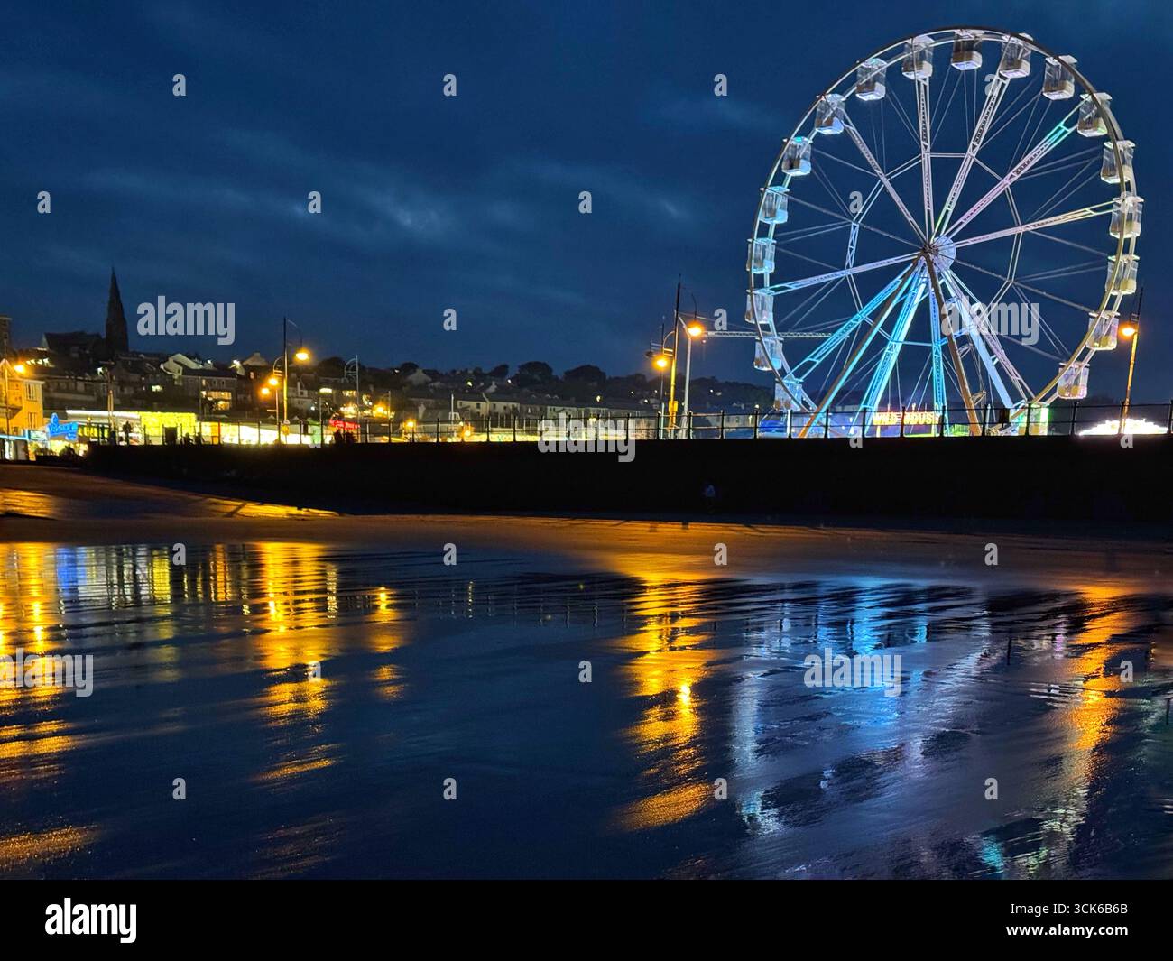 Funfair at Tramore, County Waterford, Republic of Ireland, dusk Stock ...