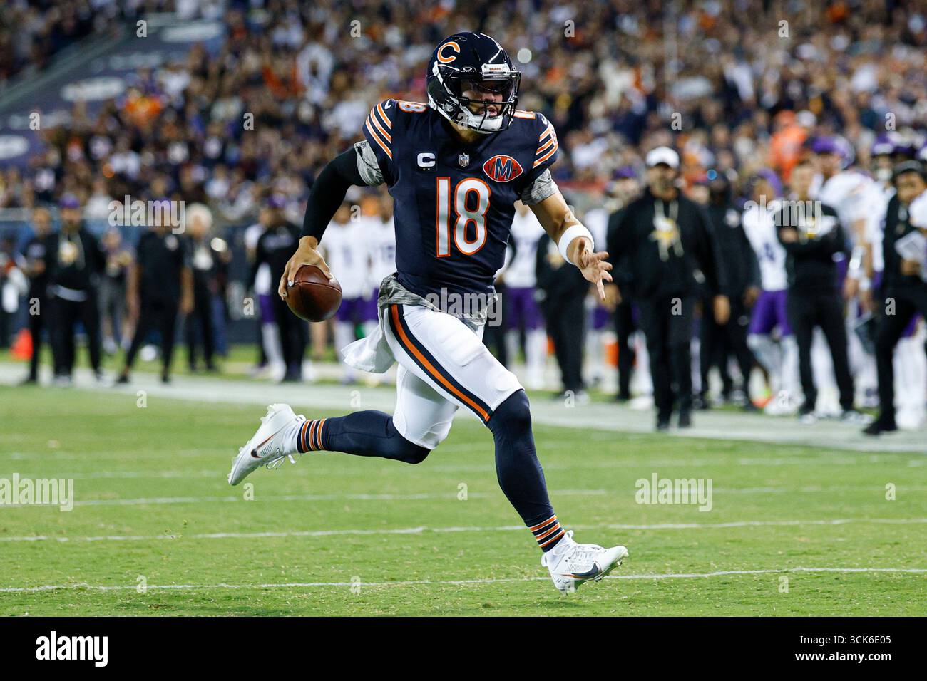 Chicago Bears quarterback Caleb Williams (18) runs with the ball to ...