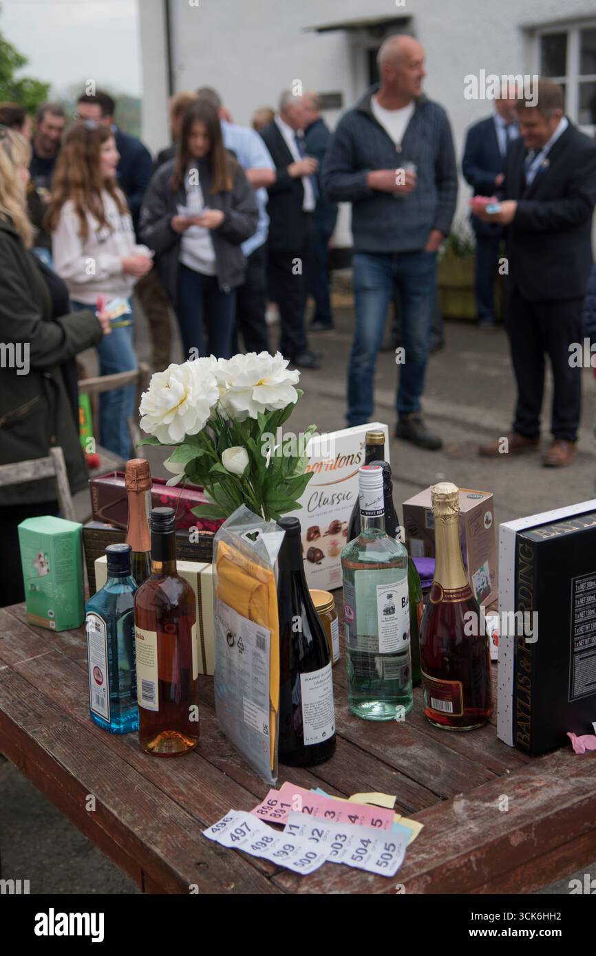 Raffle prizes on display outside a village pub. Prizes mainly alcohol ...