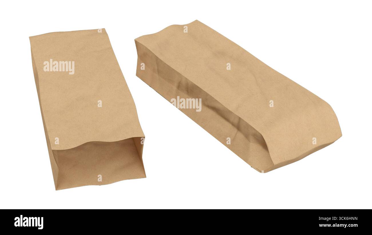 Two crumpled brown paper bags, one upright and the other on its side ...