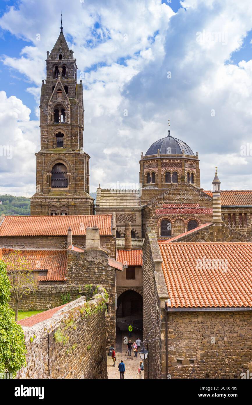 Tower and dome of the historic Notre Dame cathedral in Le Puy-en-Velay ...