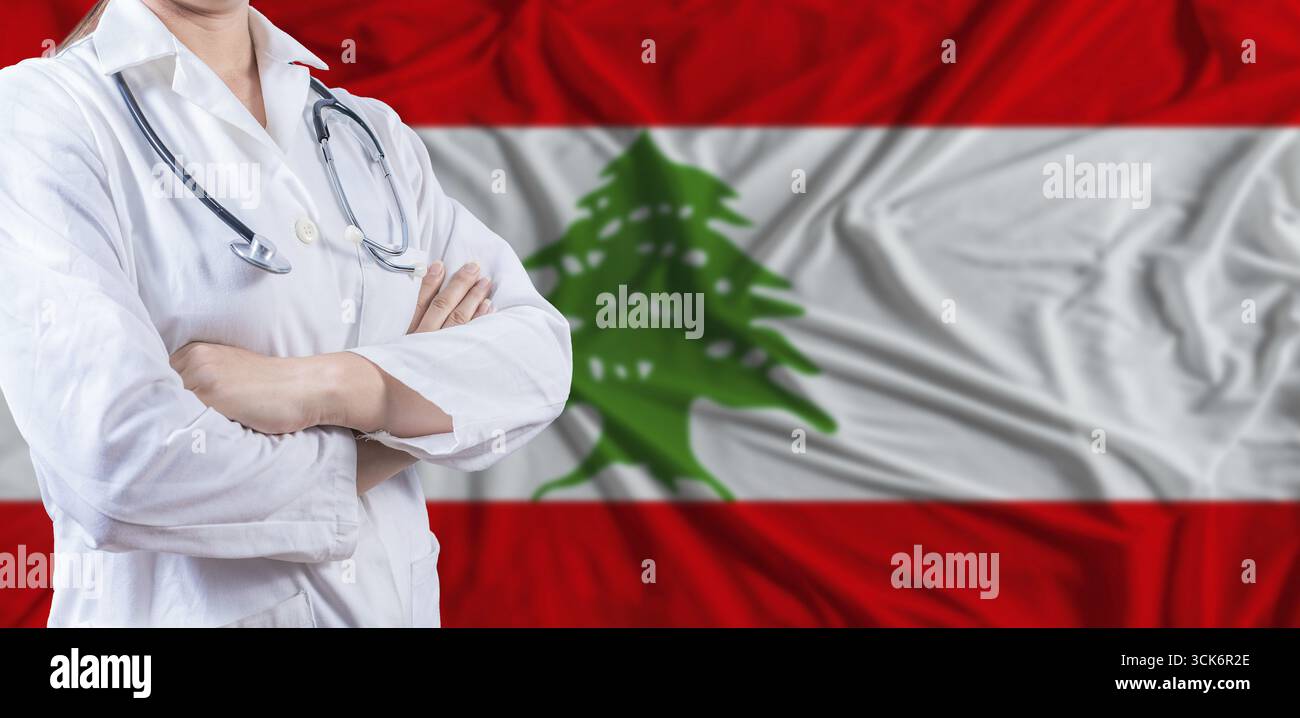 Doctor with crossed arms on Lebanon flag. Lebanese health and care ...