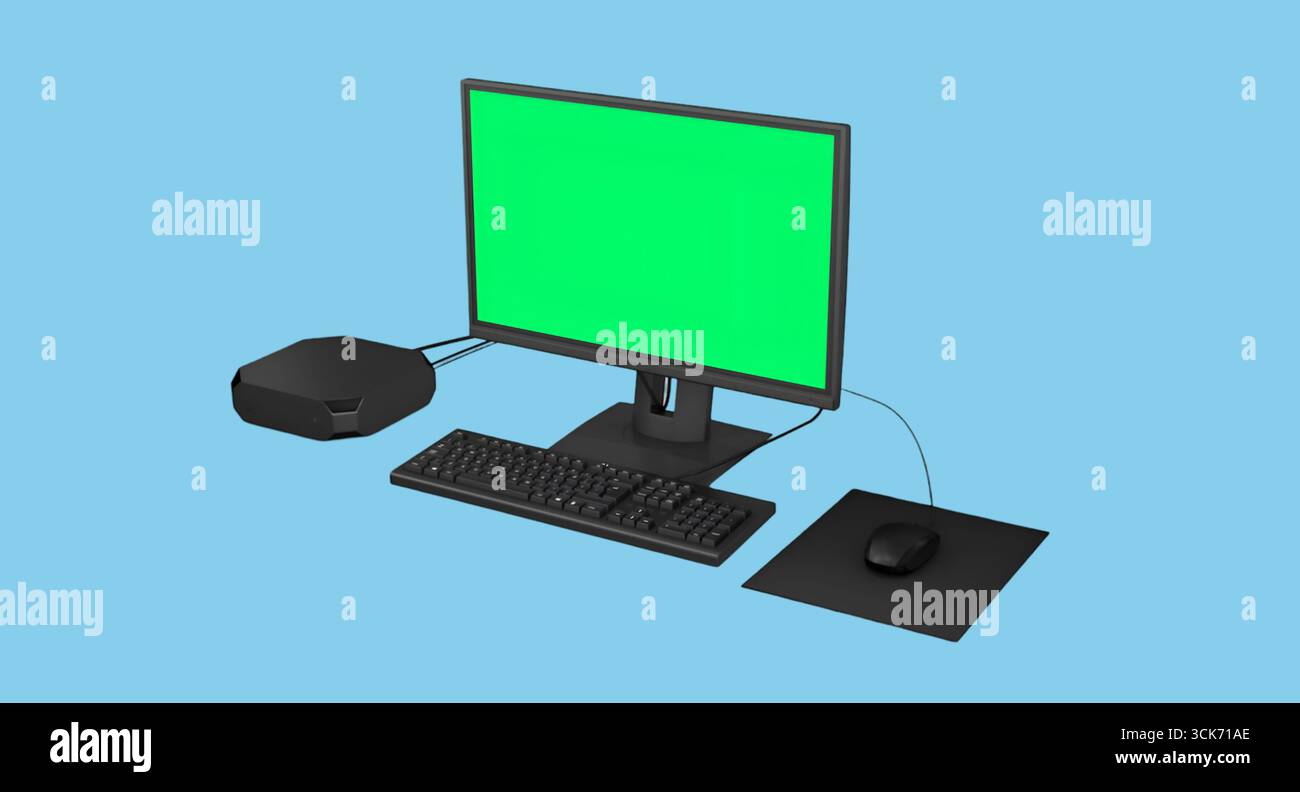 A computer setup featuring a monitor, keyboard, mouse, and a compact ...