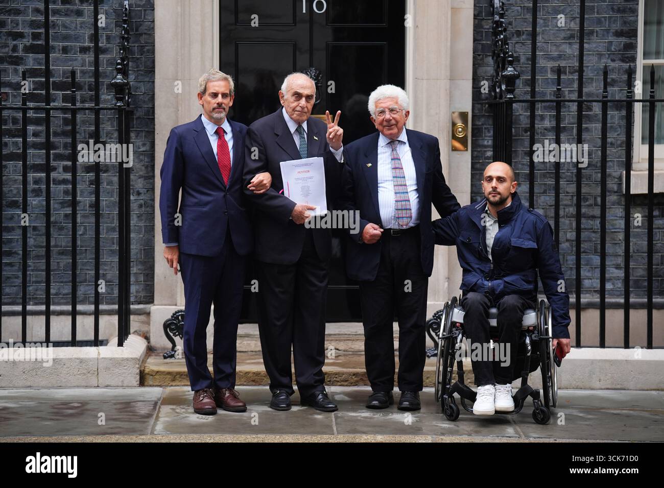 Campaigners Avi Shlaim (2nd right), Munib al-Masri (2nd left) and his ...