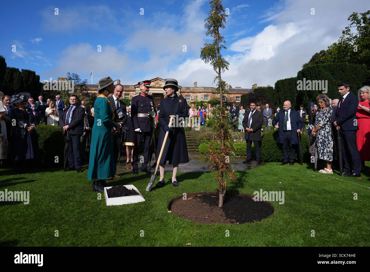 The Princess Royal plants a tree as she attends the annual garden party ...