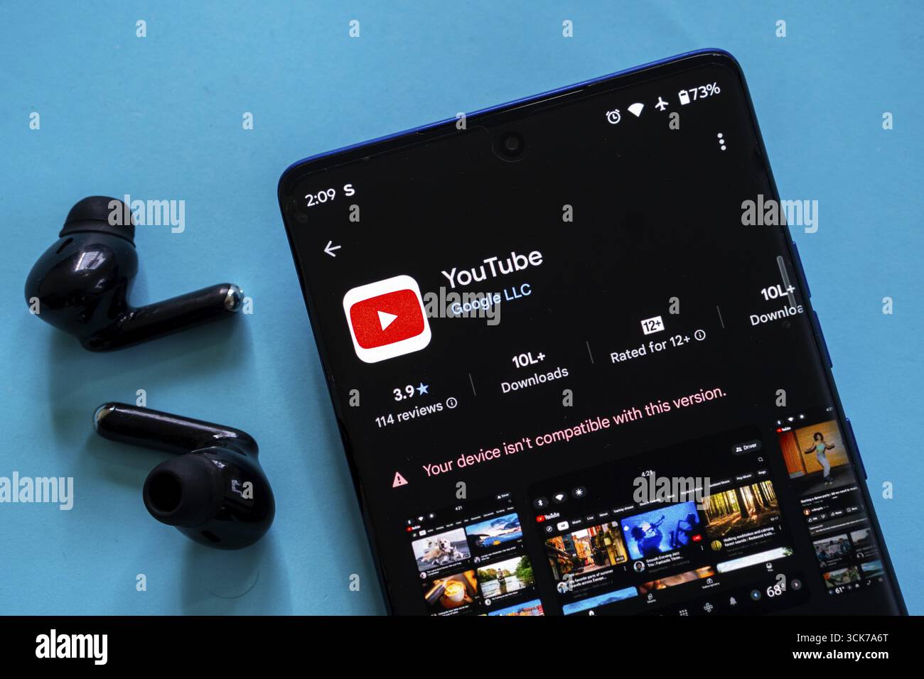 A smartphone screen showing the YouTube app interface with video ...