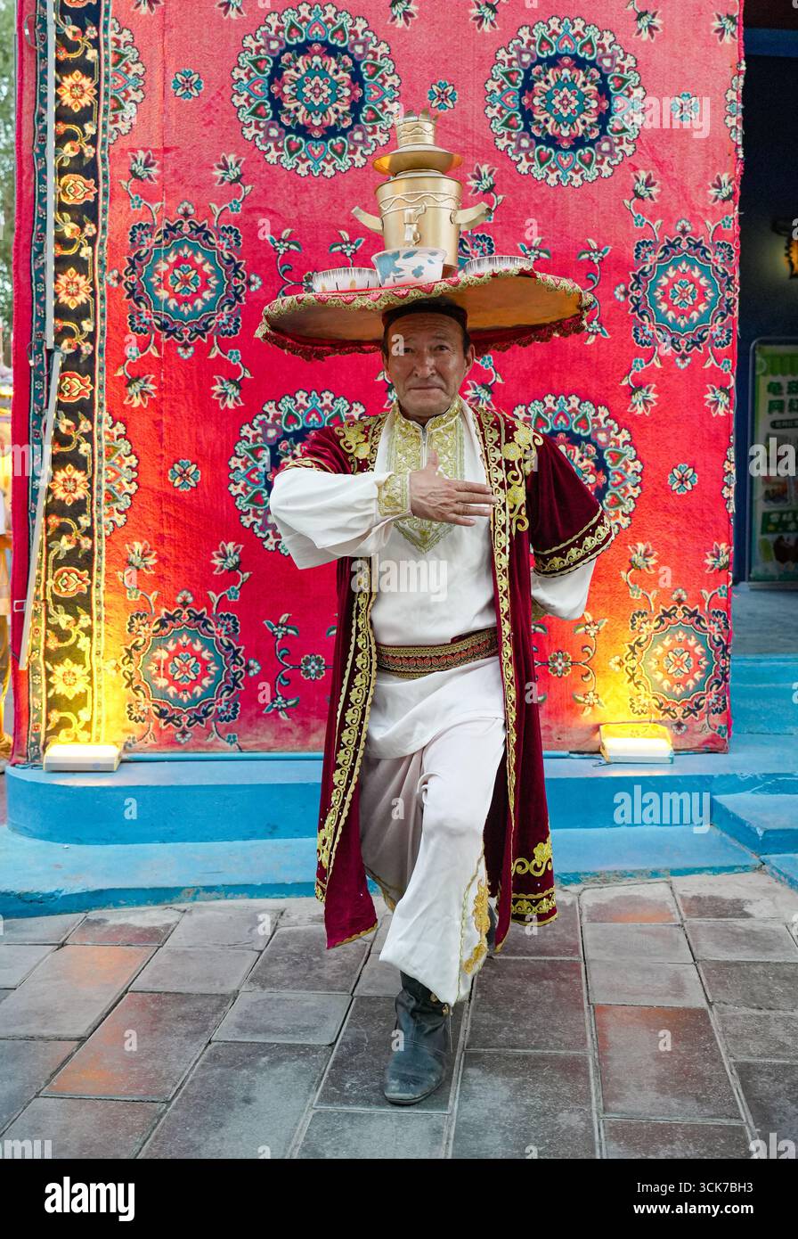 (250910) -- URUMQI, Sept. 10, 2025 (Xinhua) -- Parhat Emin performs the ...