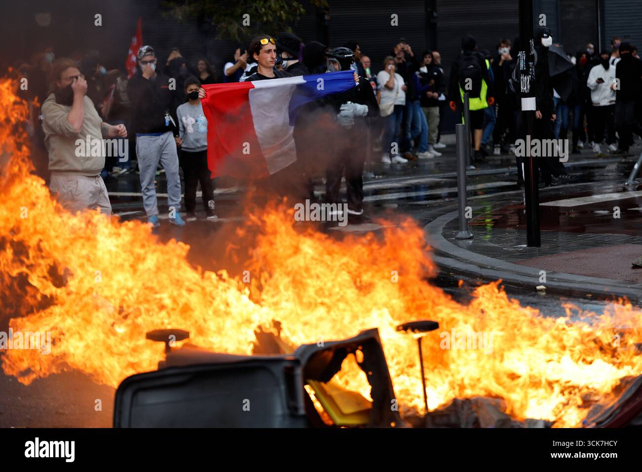 A protester of the "Block Everything" movement displays a French ...