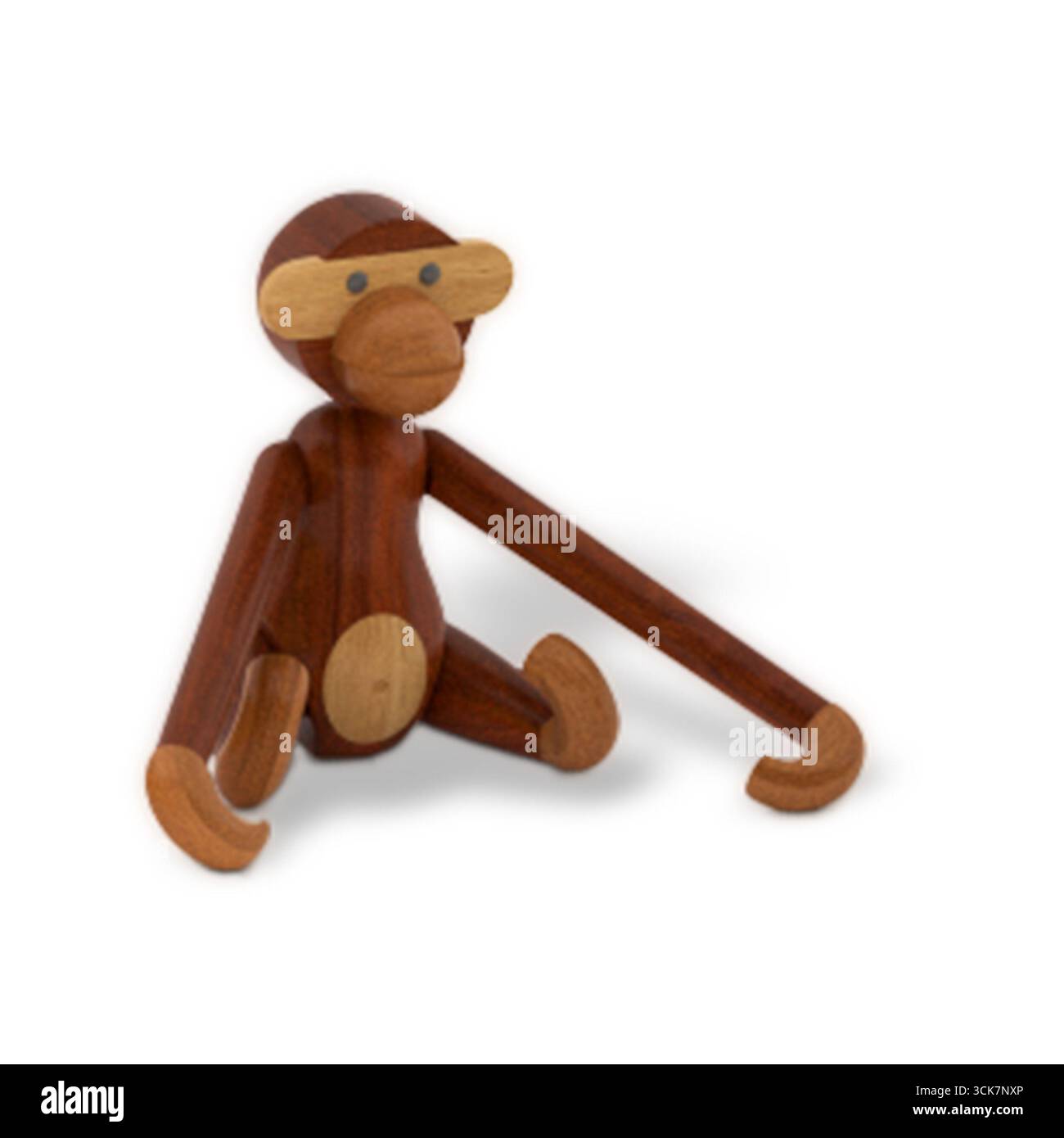 A wooden monkey figurine with movable limbs, designed as a playful and ...