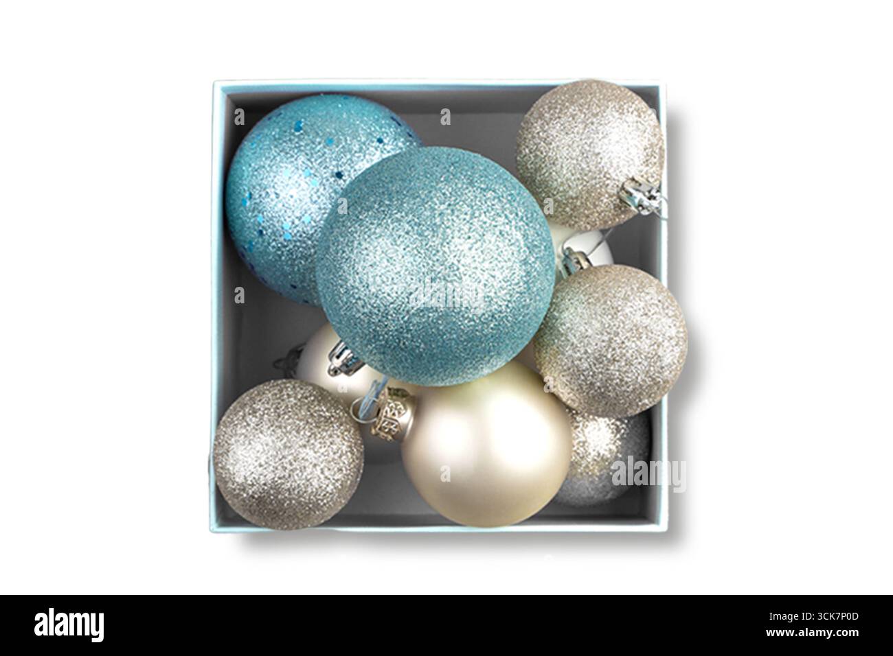 A collection of decorative Christmas ornaments in a light blue box ...