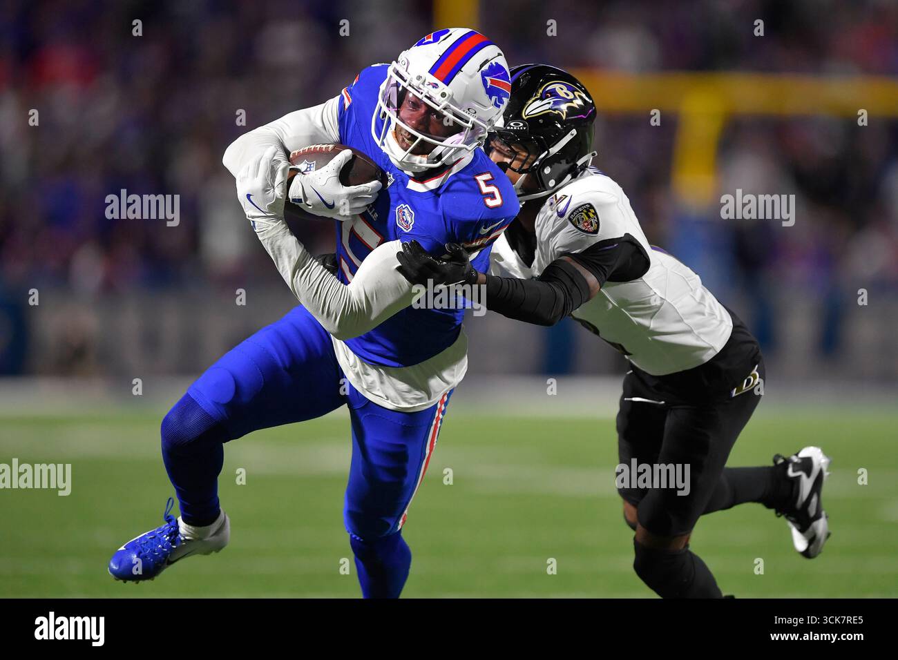 Buffalo Bills wide receiver Joshua Palmer, left, tries to break a ...