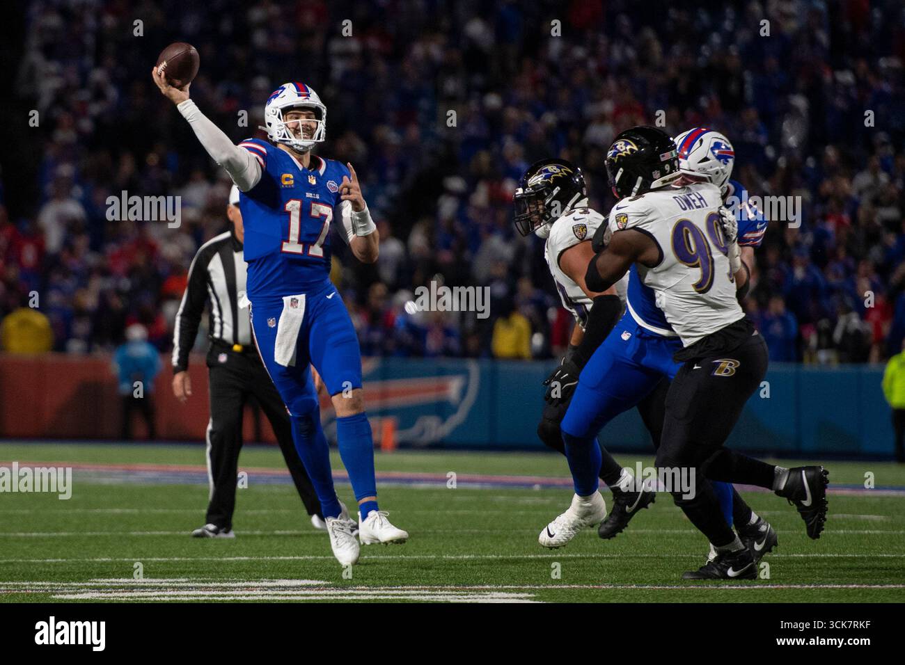 Buffalo Bills quarterback Josh Allen (17) throws while tackle Spencer ...