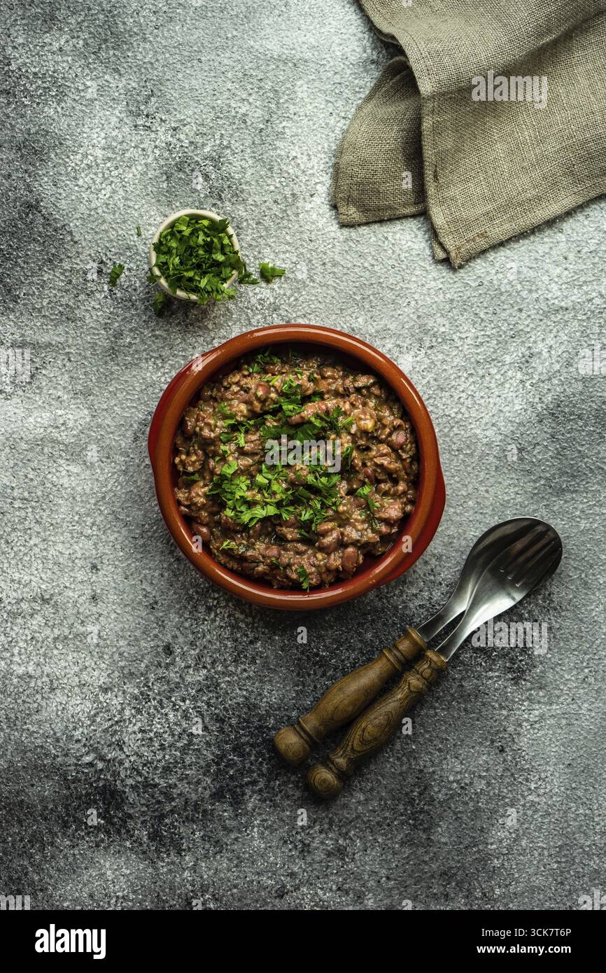 Traditional georgian red beans dish lobio with pomegranate on rustic ...